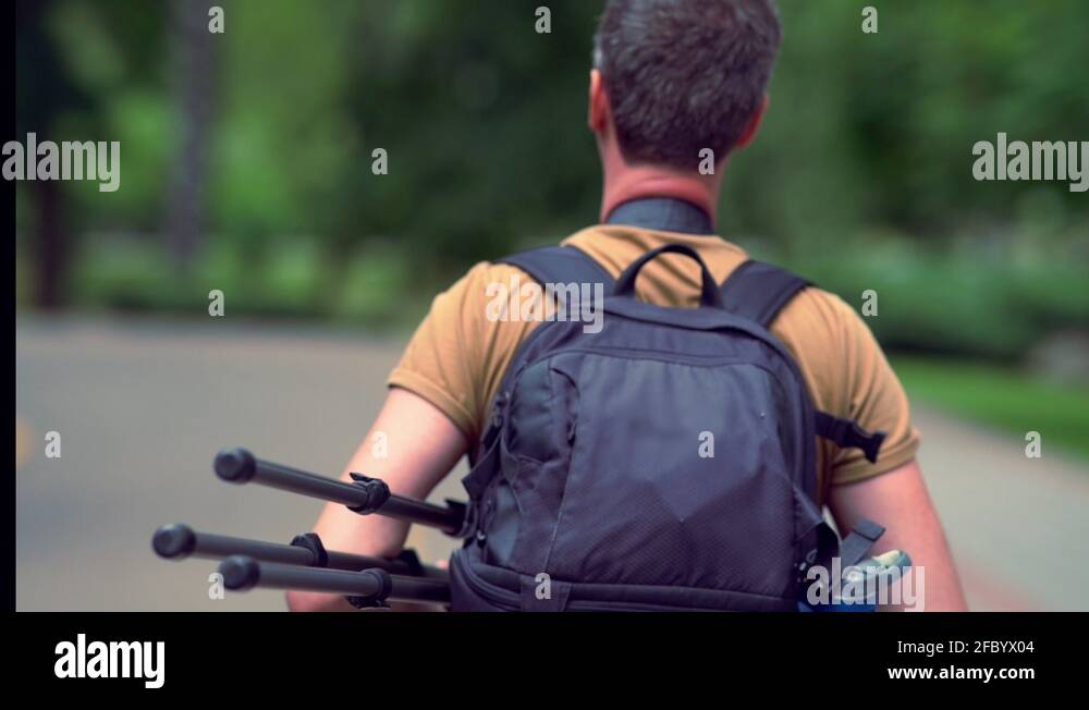 Man carrying camera bag Stock Videos & Footage - HD and 4K Video Clips ...