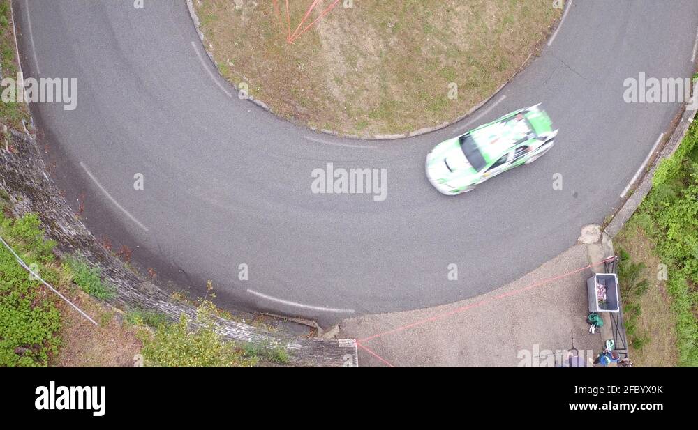 Overhead top down aerial view of motorsport racing car through curvy ...