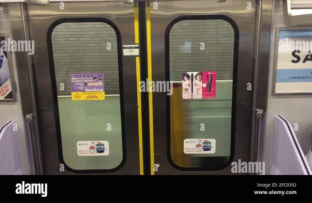 Subway train doors opening in Tokyo, Japan as train stops Stock Video ...