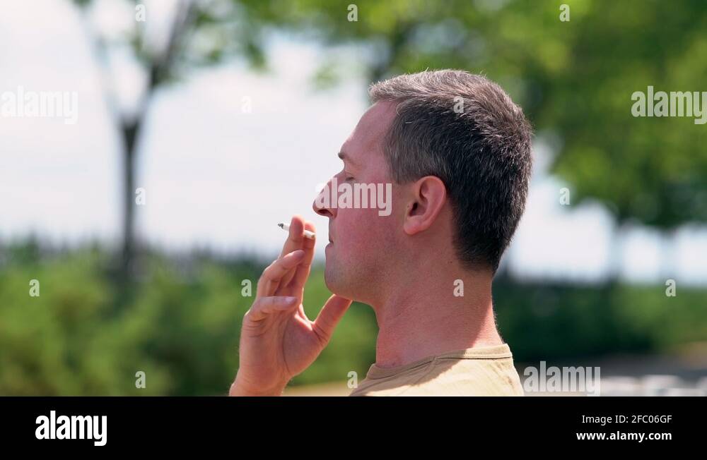 Puffing on cigarette Stock Videos & Footage - HD and 4K Video Clips - Alamy
