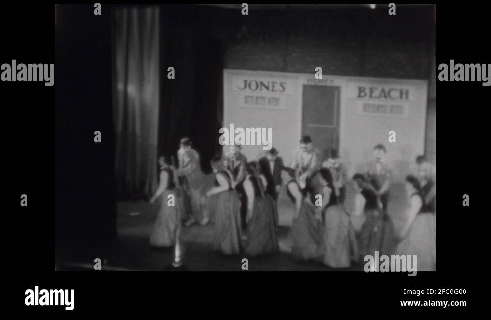 1940s: UNITED STATES: dancers on stage. Cast wave at audience as ...