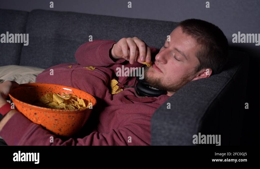 Slob man sofa Stock Videos & Footage - HD and 4K Video Clips - Alamy