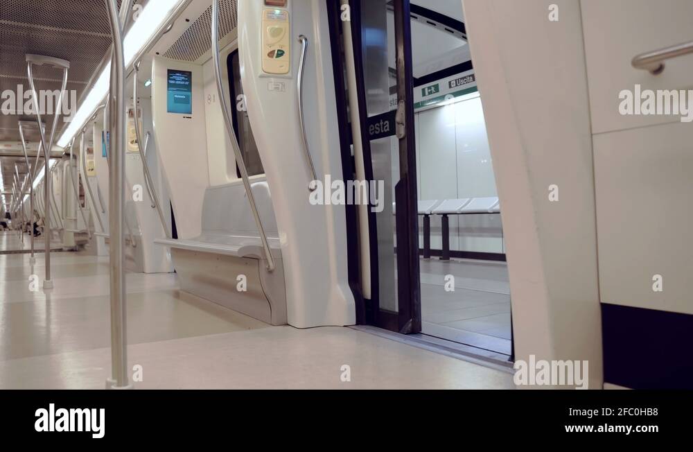 Modern white color subway train waiting at the railway station and then ...