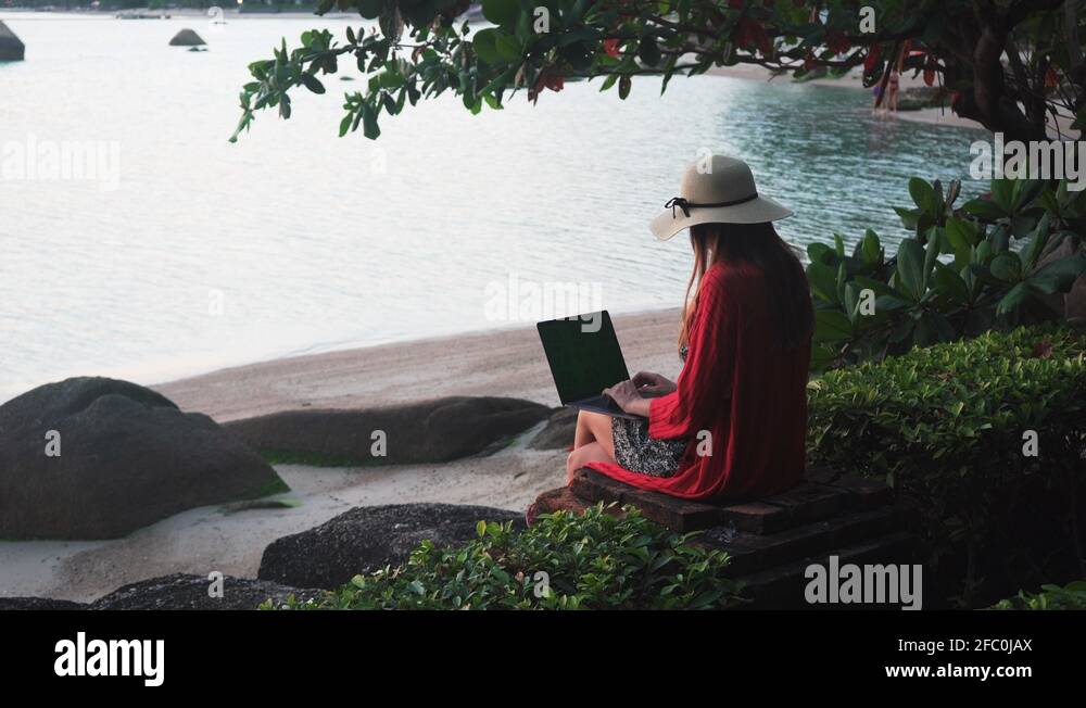 Woman Working on Beach near Sea on Sunset 4K. Green Screen Mock up ...