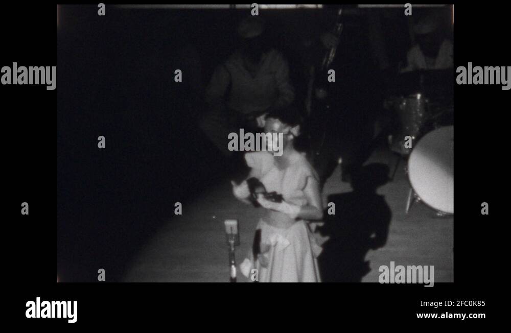 1940s: UNITED STATES: dancers with painted faces on stage. Spotlight on ...