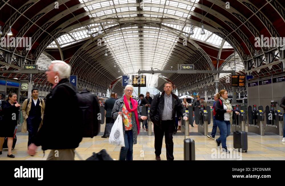 Crowd of Commuters Passing Through Automated Ticket Gates at Busy Train ...