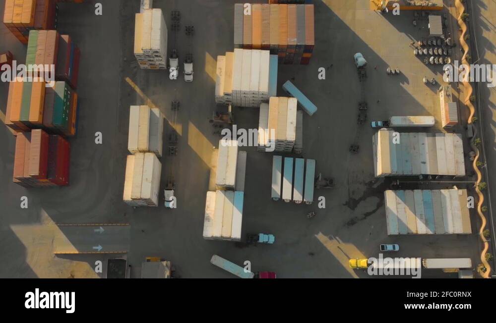Shipping containers stacked up in desert-like port side area Stock ...