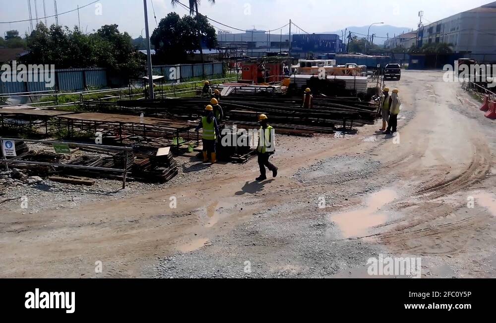 Construction workers working at the steel reinforcement bar bending ...