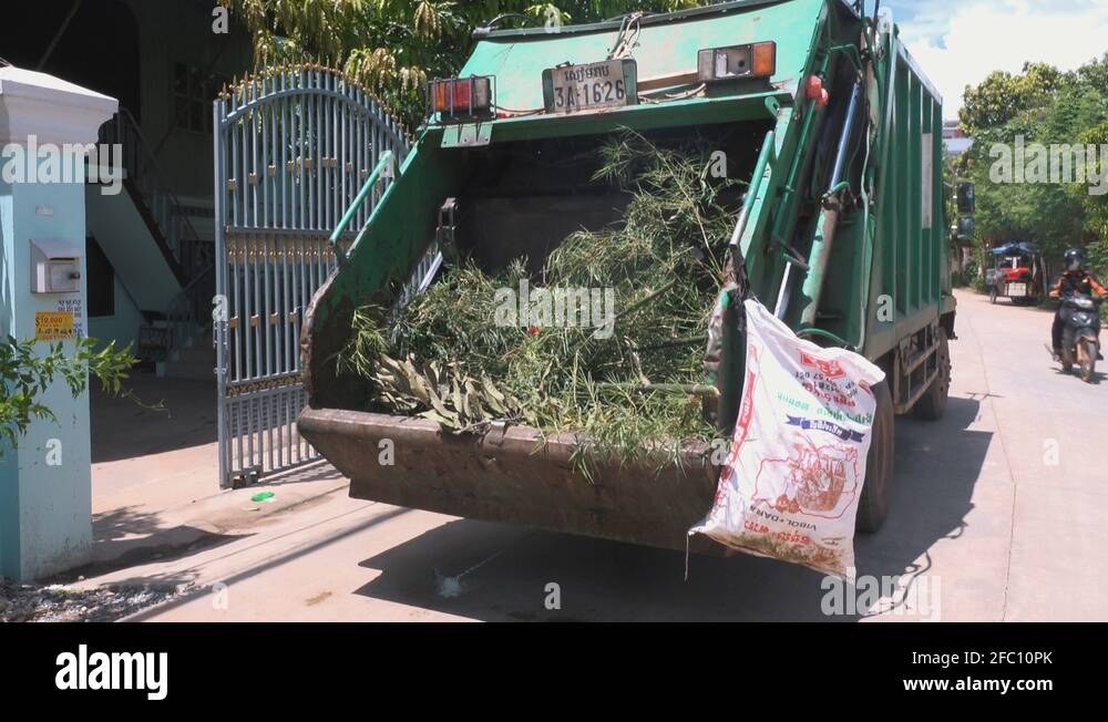 Garbage truck collecting trash in Stock Videos & Footage - HD and 4K ...