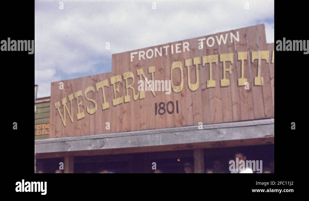 1950s: Old West theme park. Sign reads "FRONTIER TOWN WESTERN OUTFIT ...