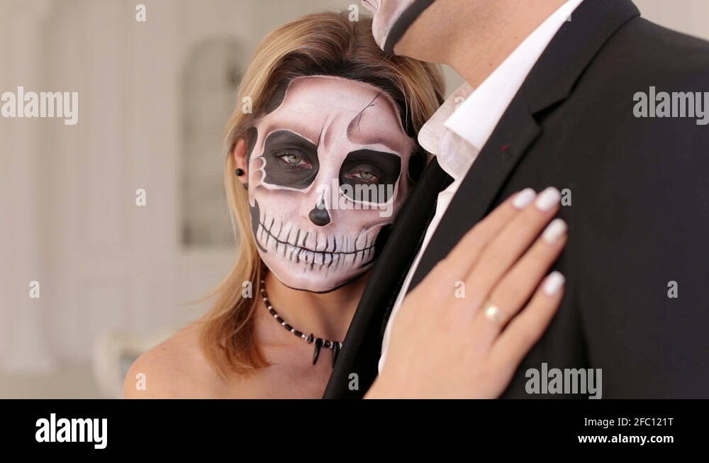 Creepy couple of actors with scary Halloween makeup in vintage costumes ...