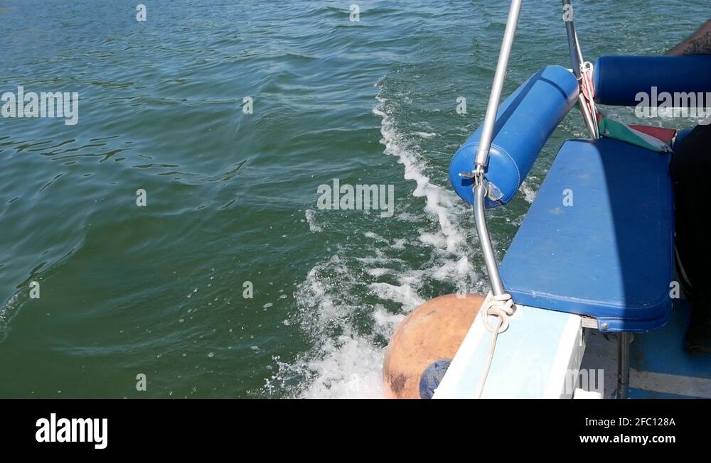 Water splashing at port side, right-hand side, of aing boat on the ...