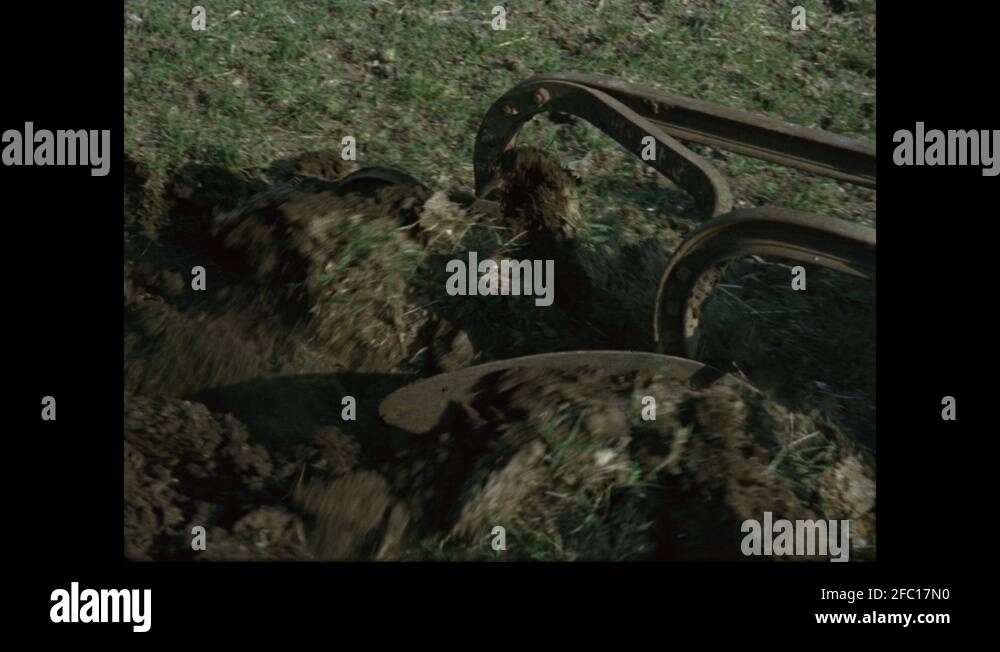 1950s: UNITED STATES: plough and ground. Plough cuts up field Stock ...