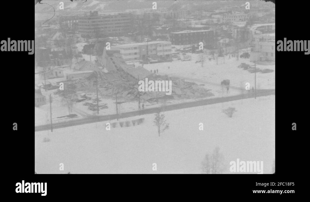 1960s: Aerial views of destroyed building. Aerial view of downtown area ...