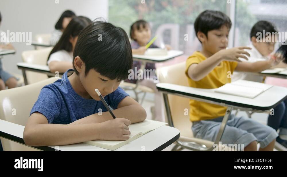 Boy writing in classroom Stock Videos & Footage - HD and 4K Video Clips ...