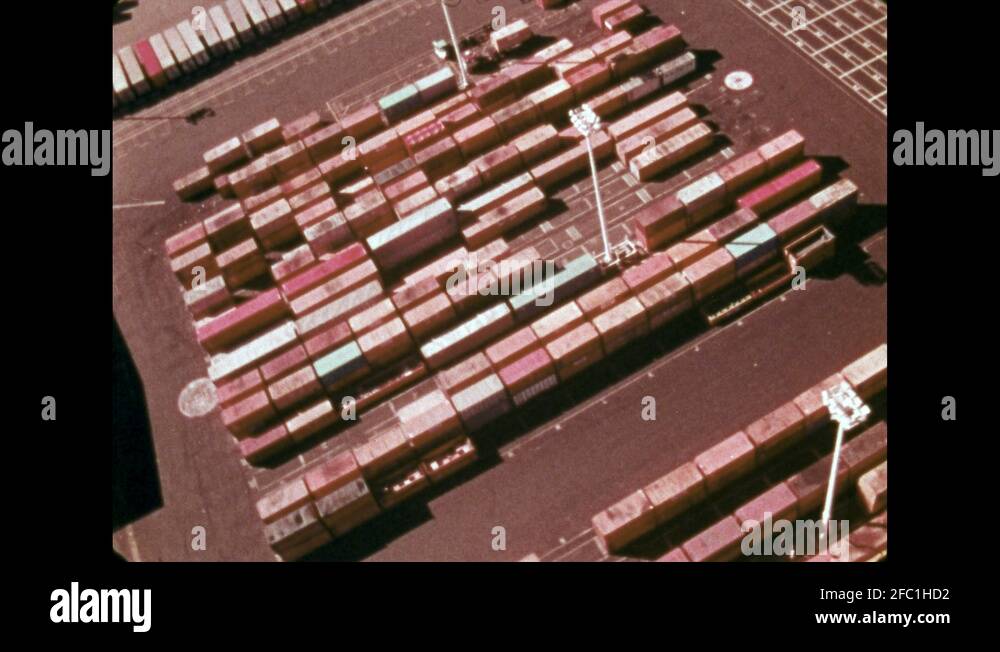 1970s: Aerial footage of shipping containers and truck trailers at port ...