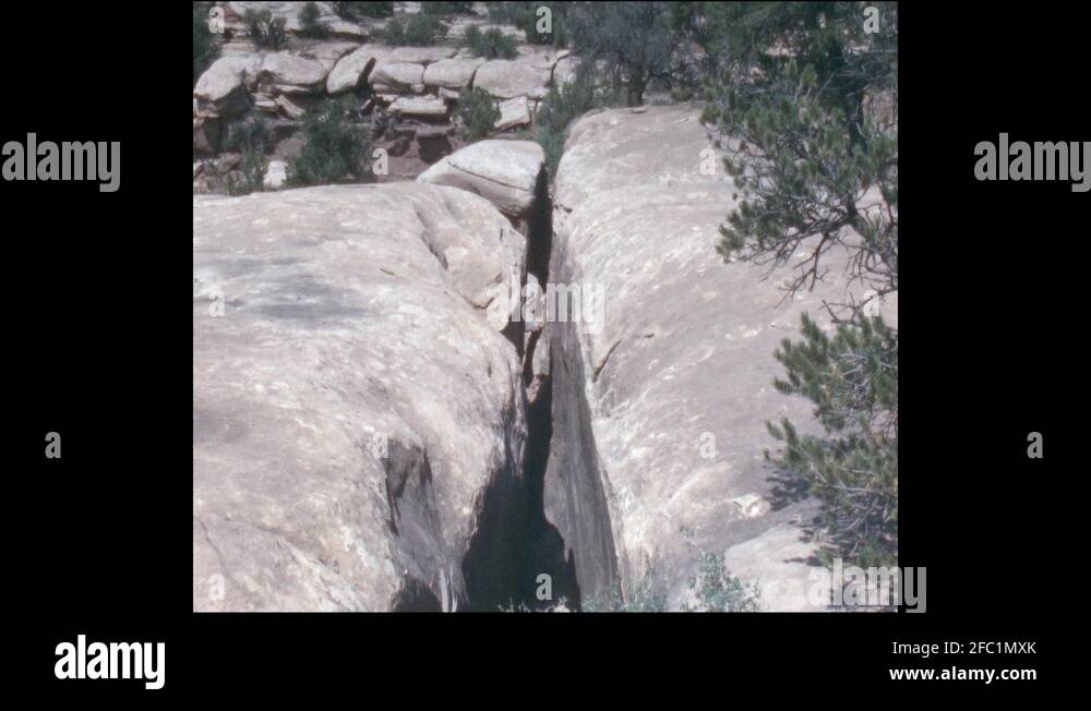 1960s: Narrow crevice in desert rocks Stock Video Footage - Alamy