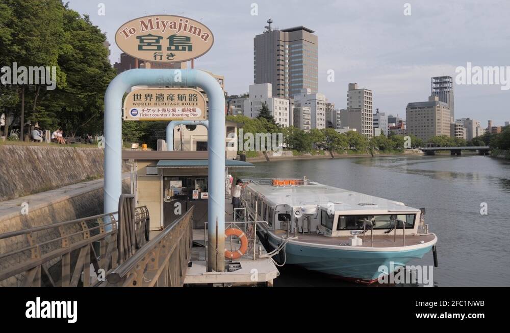 Tour boat to Miyajima on river,Hiroshima,Japan Stock Video Footage - Alamy