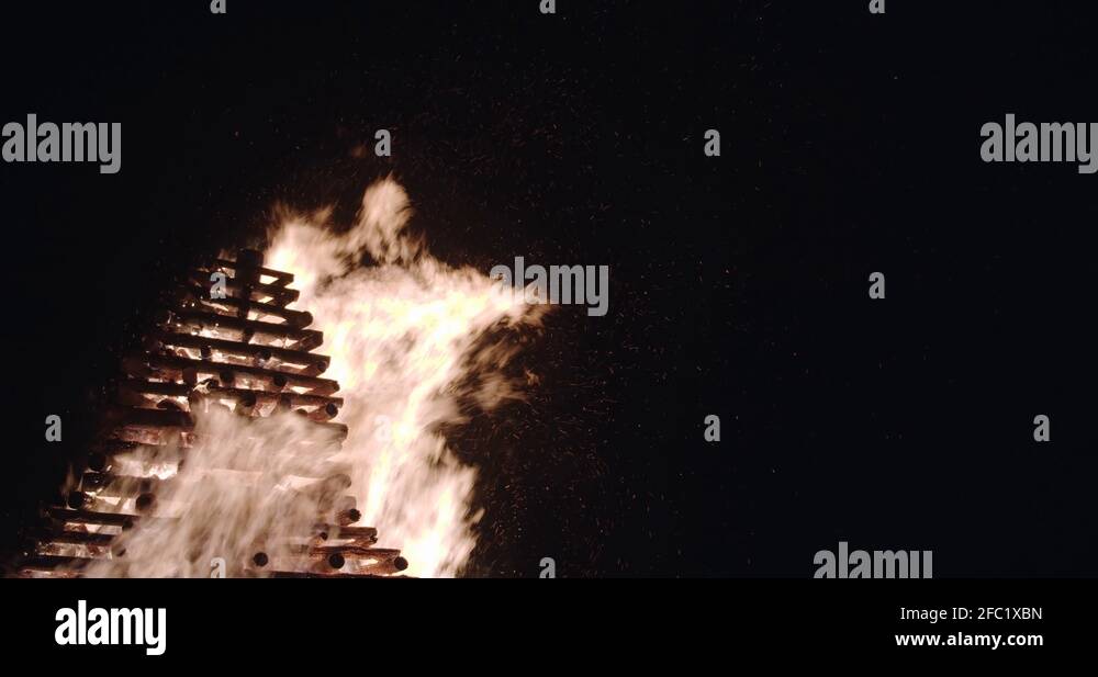 Fire flames and sparks in sacrificial fire. slow motion isolated on ...