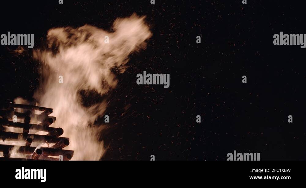 Fire flames and sparks in sacrificial fire. slow motion isolated on ...