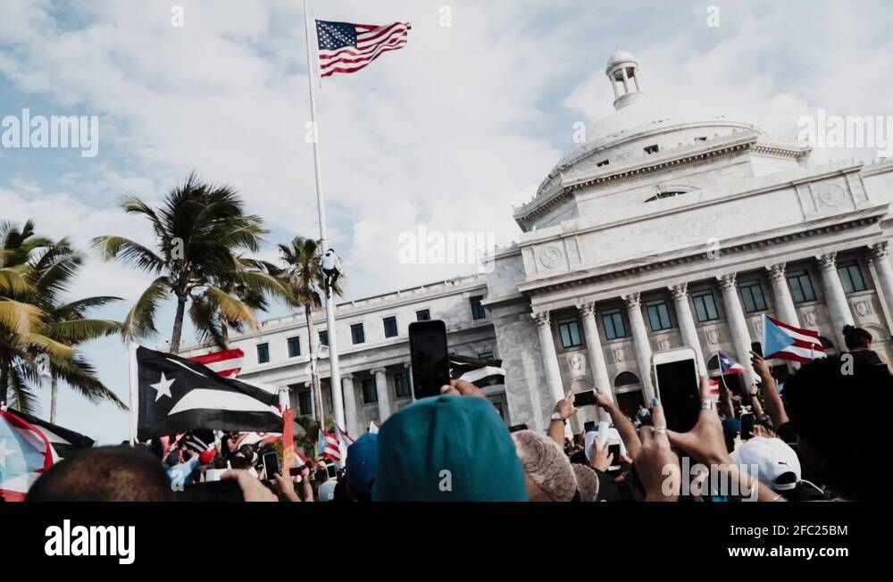 Man climbs flag pole to replace the American flag as hundreds of ...