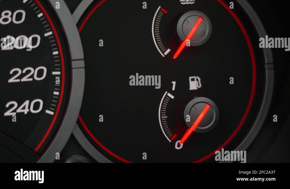 Zoom in the black fuel dashboard gauge. Close up car control panel ...