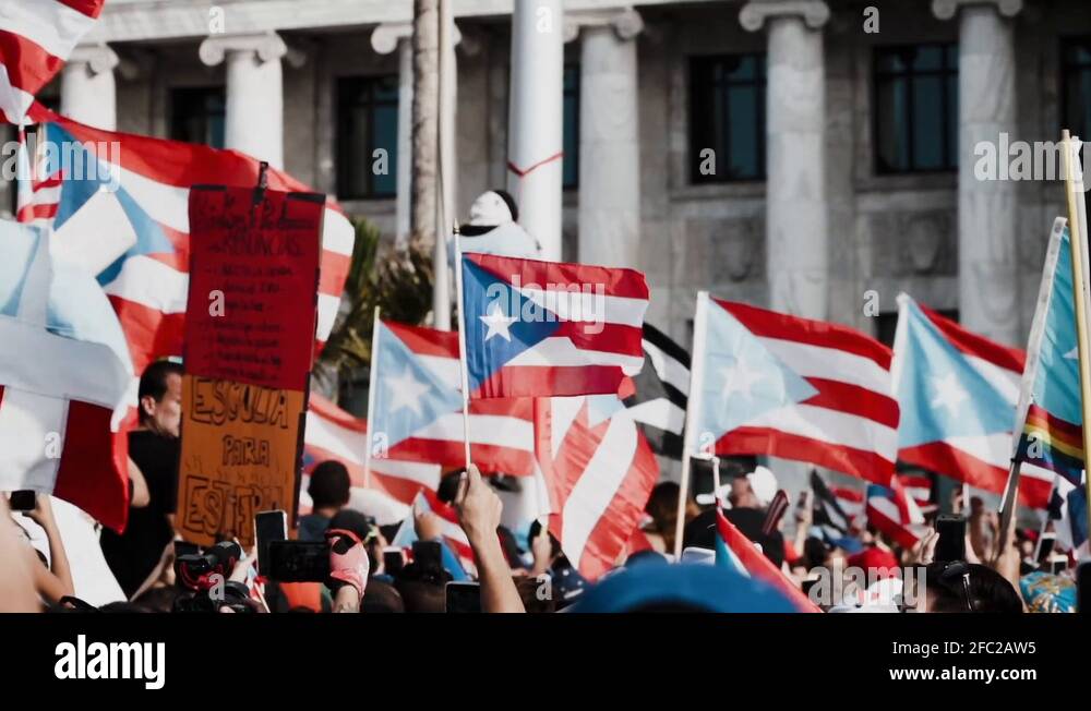 Man climbs flag pole to replace the American flag as hundreds of ...