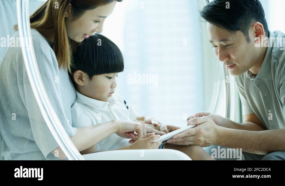 Chinese Asian mother father helping child school education Stock Video ...