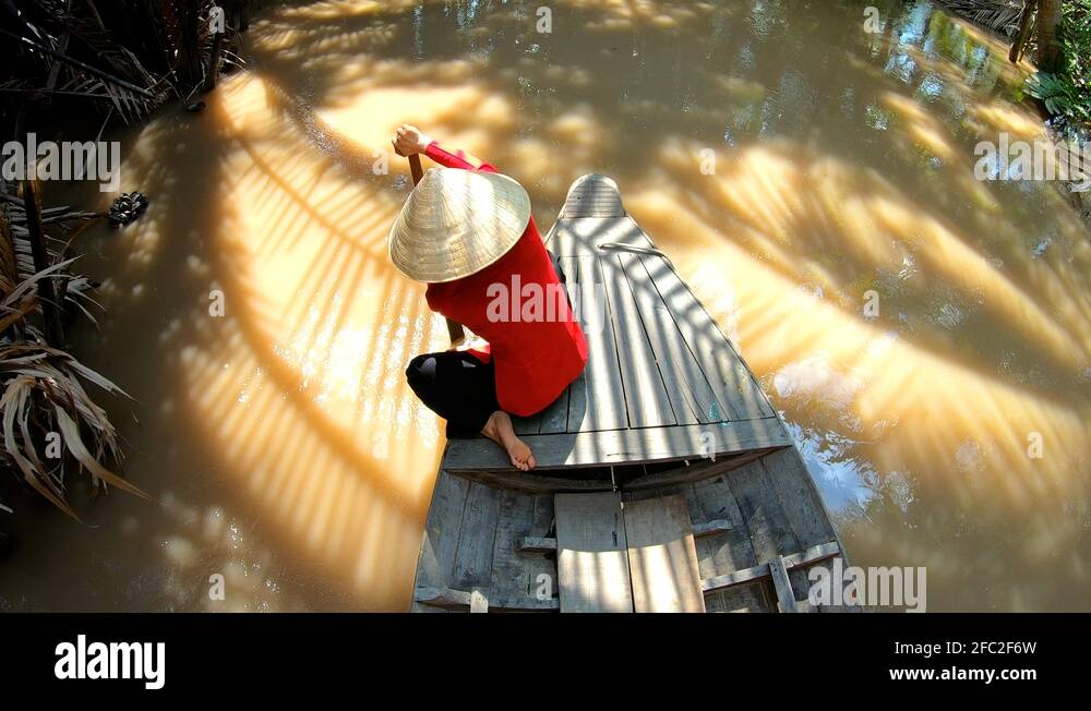 Asian female wearing conical hat paddling Sampan Vietnam Stock Video ...
