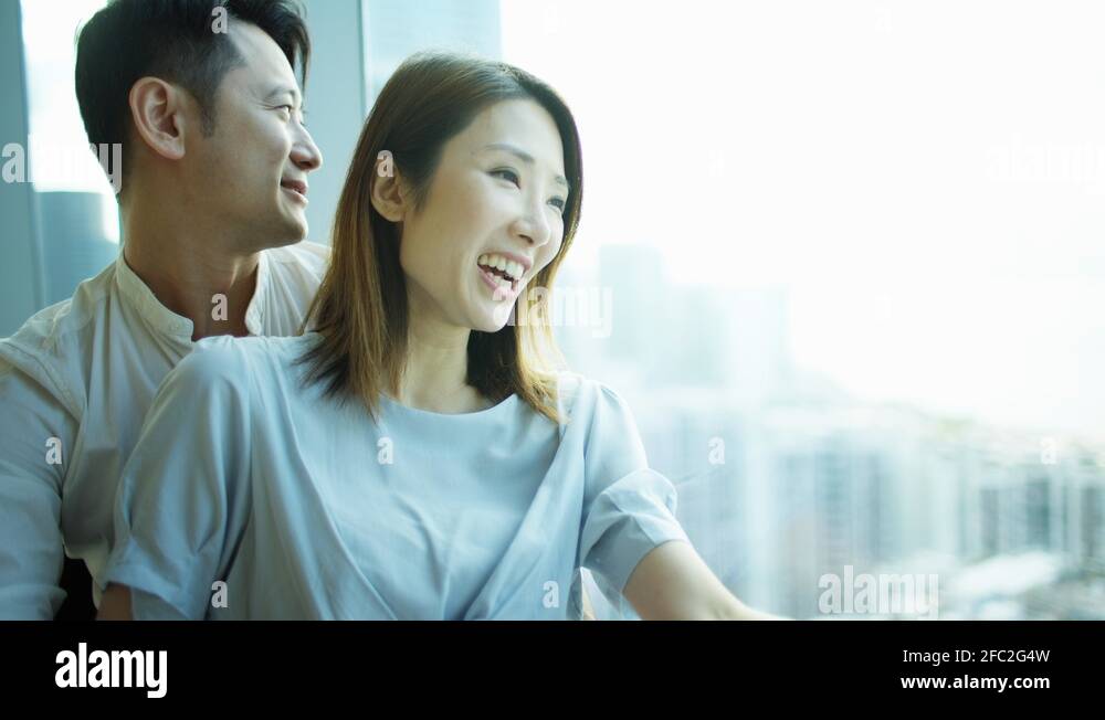 Asian Chinese man embracing woman in modern room Stock Video Footage ...