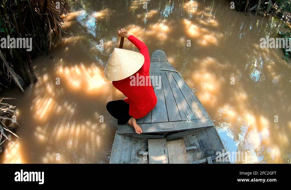 Asian female wearing conical hat rowing Sampan Vietnam Stock Video ...