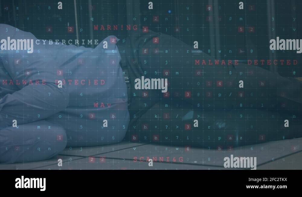 Man sleeping in server room while security danger messages flash in the ...
