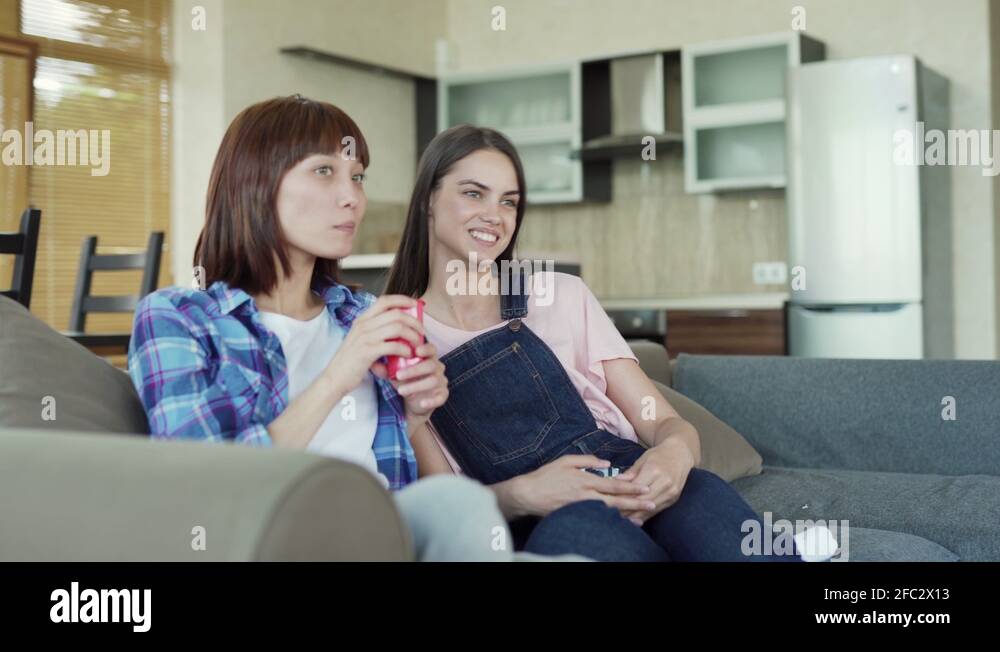 Two girls watching tv Stock Videos & Footage - HD and 4K Video Clips ...