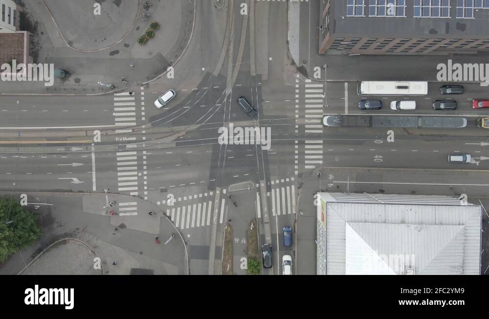 Cars, trams and people on crossroad. Crossing street with traffic ...
