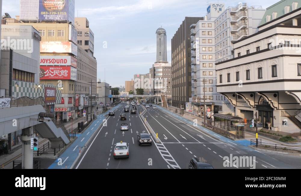 Busy street in downtown with Yume tower,Shimonoseki,Honshu,Japan Stock ...