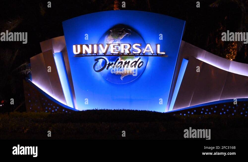 Illuminated Universal Studios sign and logo at dark night background ...