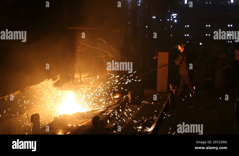 Melting of metal in a steel plant. High temperature in the melting ...