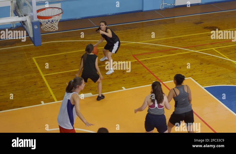 High Angle of Female Athletes Playing Basketball and Scoring a Point ...