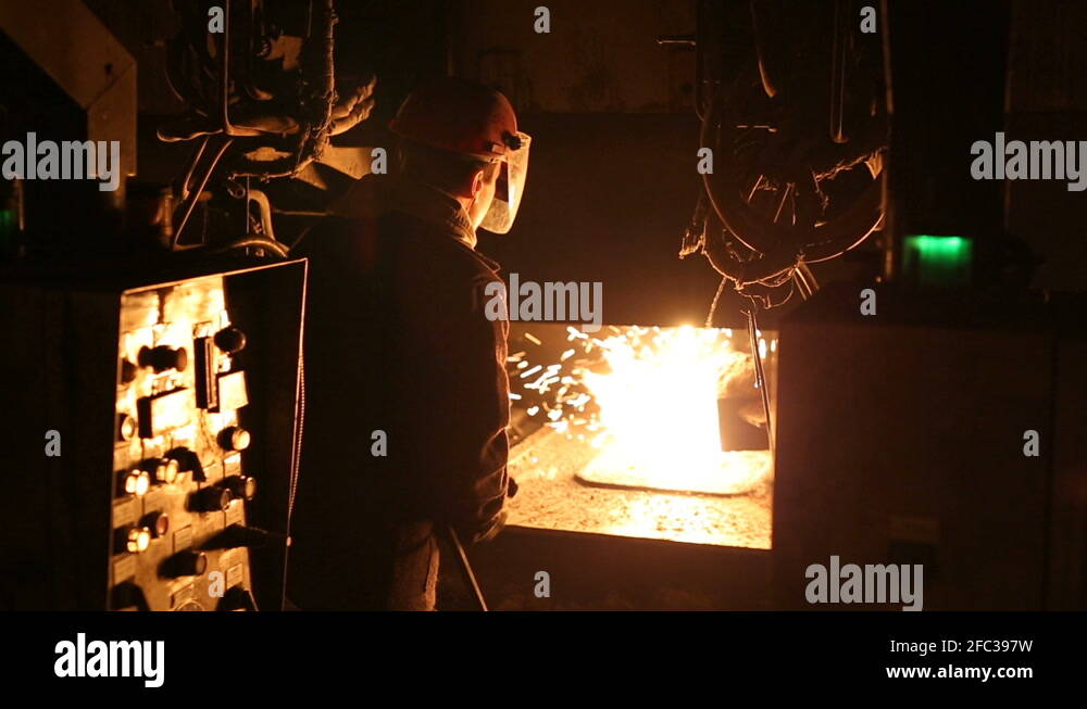 Melting of metal in a steel plant. High temperature in the melting ...