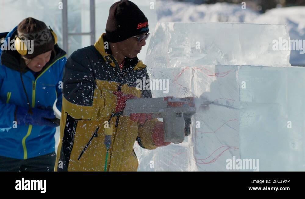 Ice carver from japan uses an electric chainsaw to sculpt the ice, slow ...