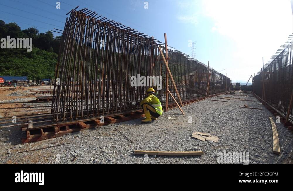 Construction workers fabricating steel reinforcement bar to form Stock ...