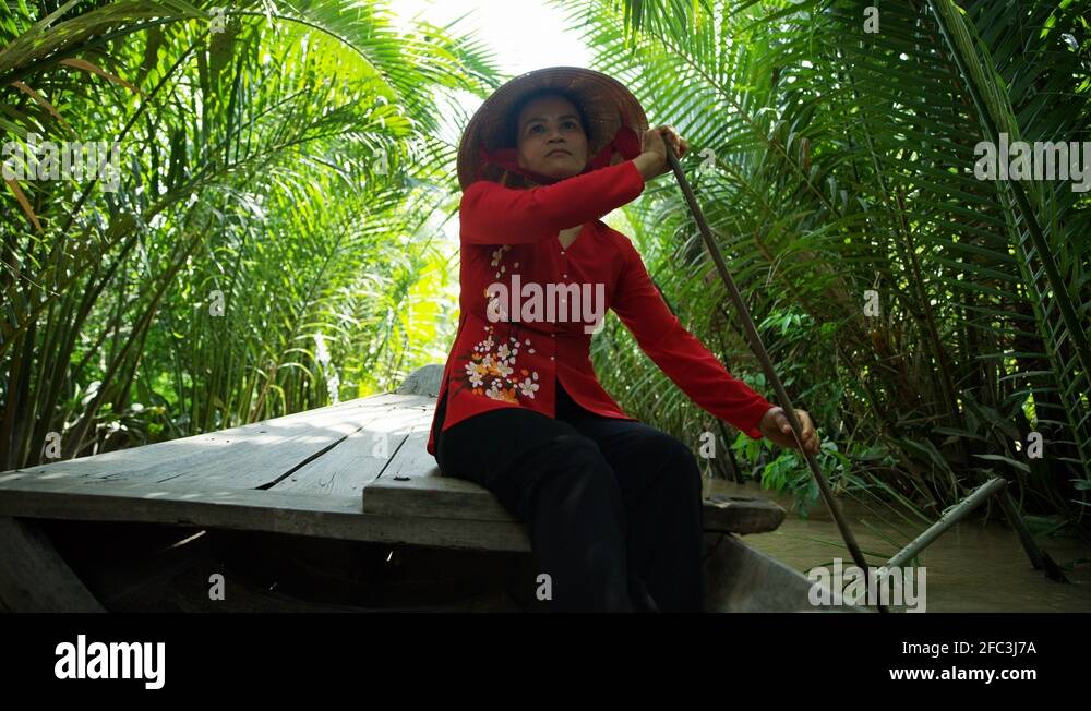 Asian lady wearing conical hat rowing Sampan Vietnam Stock Video ...