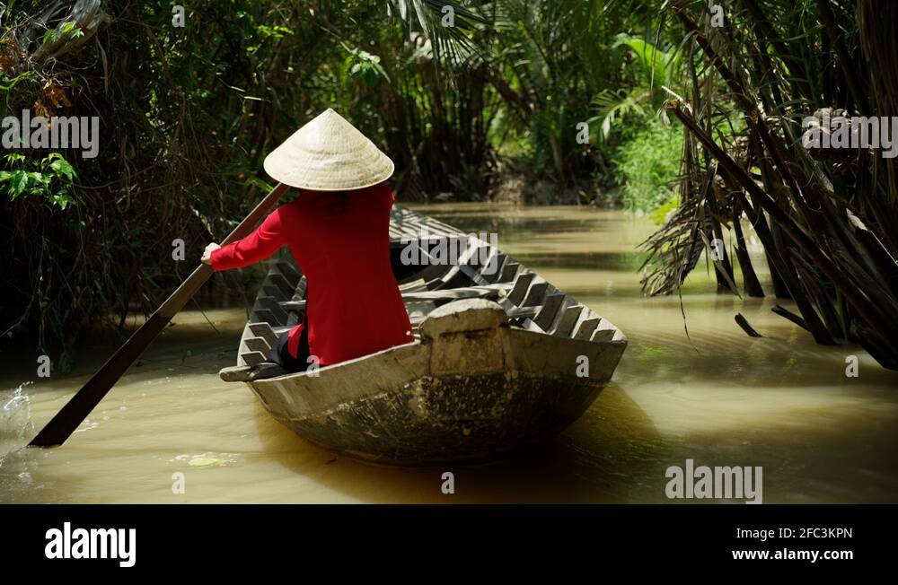 Asian female wearing traditional hat rowing Sampan Vietnam Stock Video ...