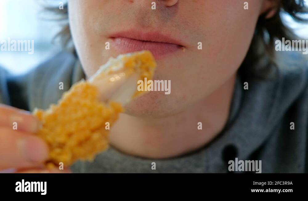 fastfood restaurant visitor with freckles eats chicken Stock Video ...