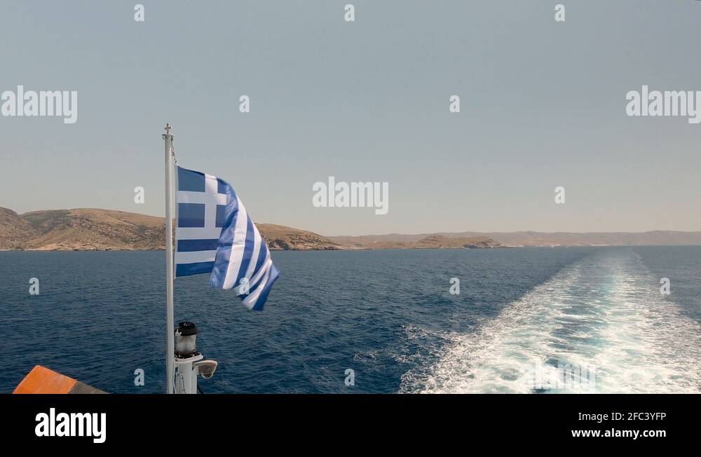 Greek National Flag Waving on Back of Ferry. Sea Water Trail and Coast ...