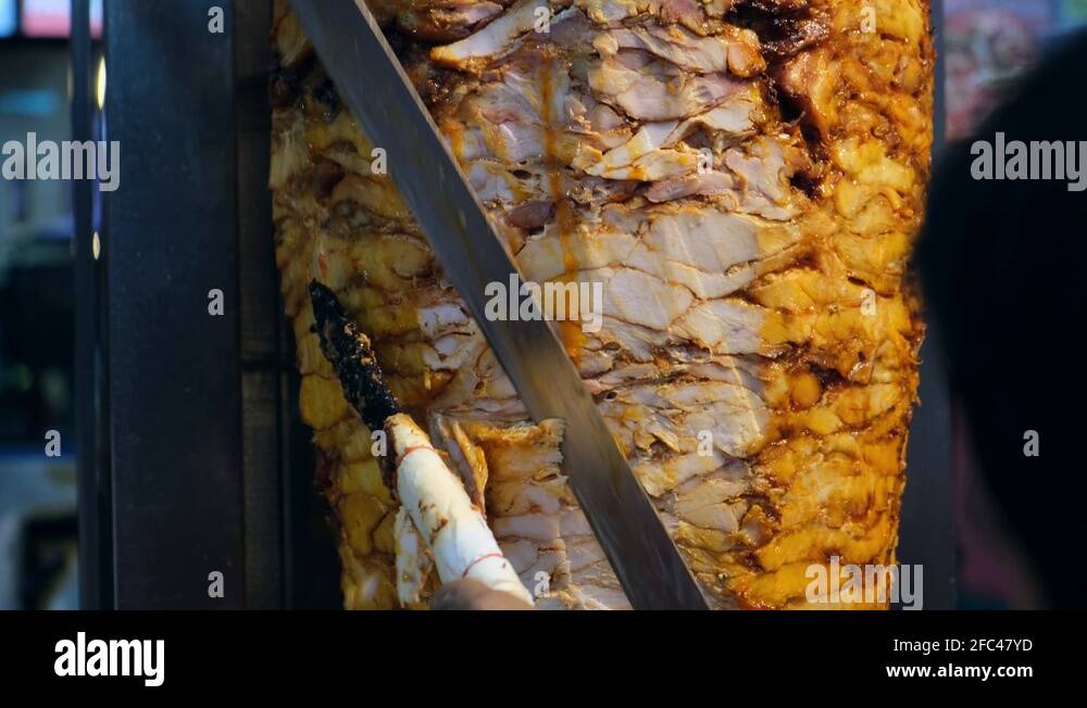 Shawarma. Closeup picture of stacked meat roasting, shawarma Stock ...