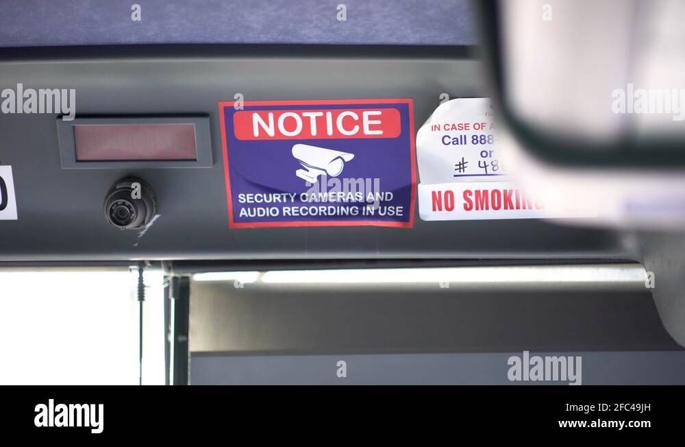 Quick 4k glimpse at a generic security camera warning sign on a public ...