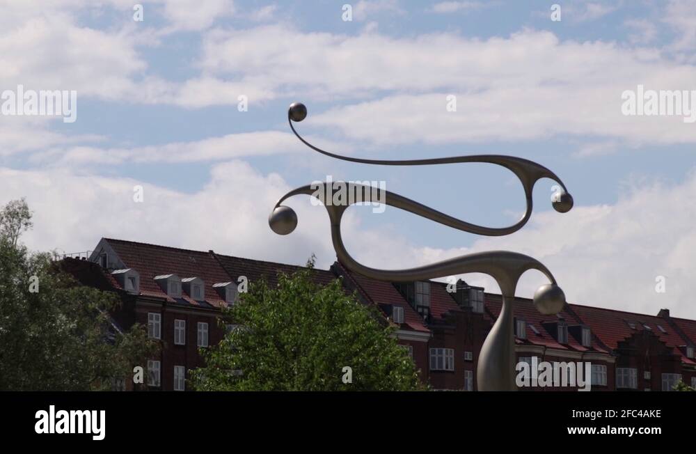 Spinning statue in Moelleparken in Aarhus, Denmark on a hot summers day ...