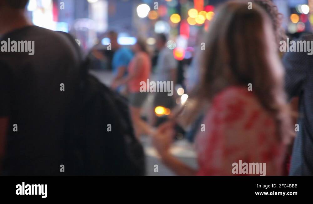 Crowd of people walking at night in New York City Times Square 24p ...
