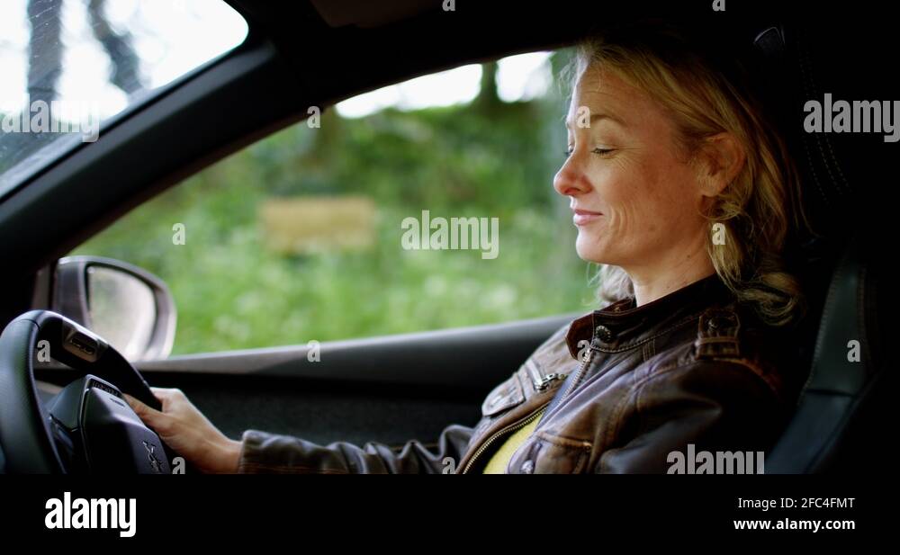 Smiling female motorist Stock Videos & Footage - HD and 4K Video Clips ...
